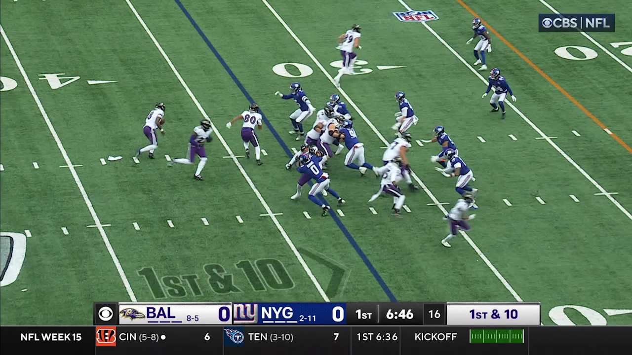 Baltimore Ravens' quarterback Lamar Jackson caps off a 14-yard run with ...