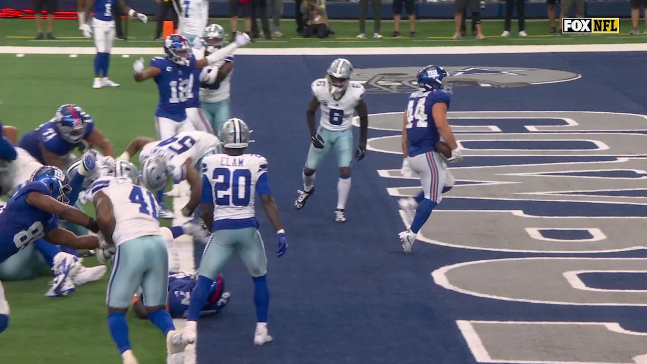 New York Giants running back Cam Skattebo launches through goal line for TD