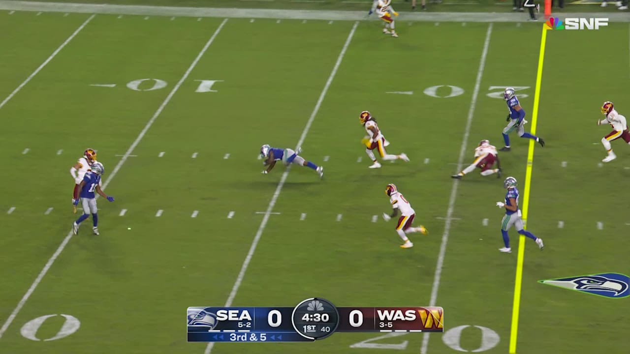 Seattle Seahawks running back Kenneth Walker III stumbles his way to a ...