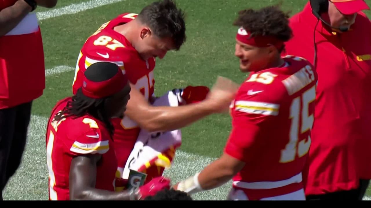 Kansas City Chiefs quarterback Patrick Mahomes, tight end Travis Kelce on behind the back pass ...