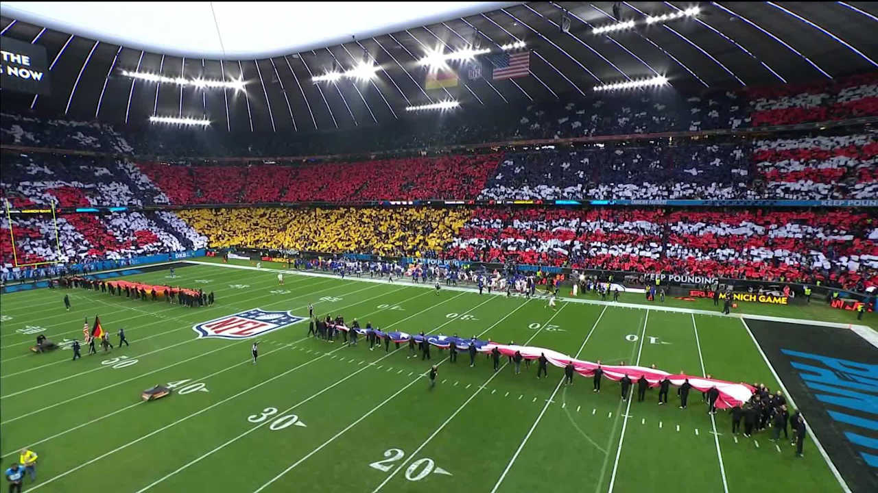 Munich crowd display US and German flags following National Anthems