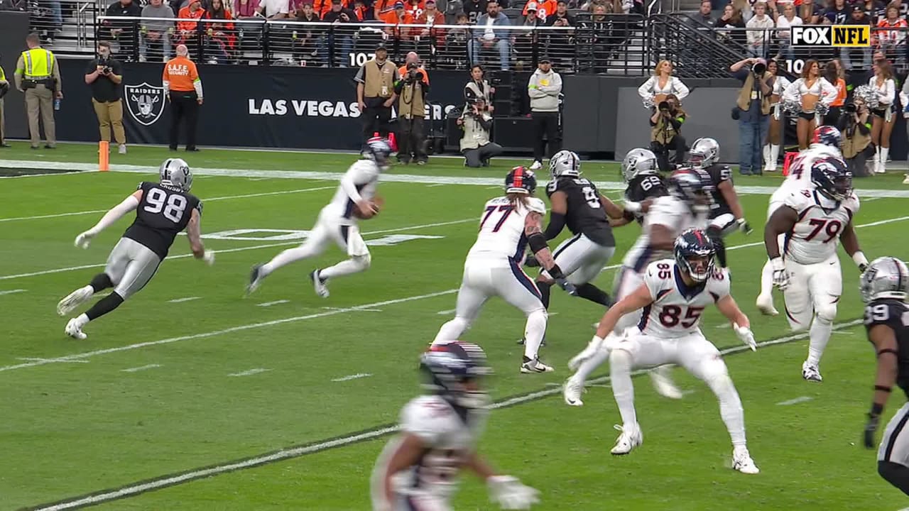 Las Vegas Raiders defensive end Maxx Crosby scares Denver Broncos quarterback Jarrett Stidham ...