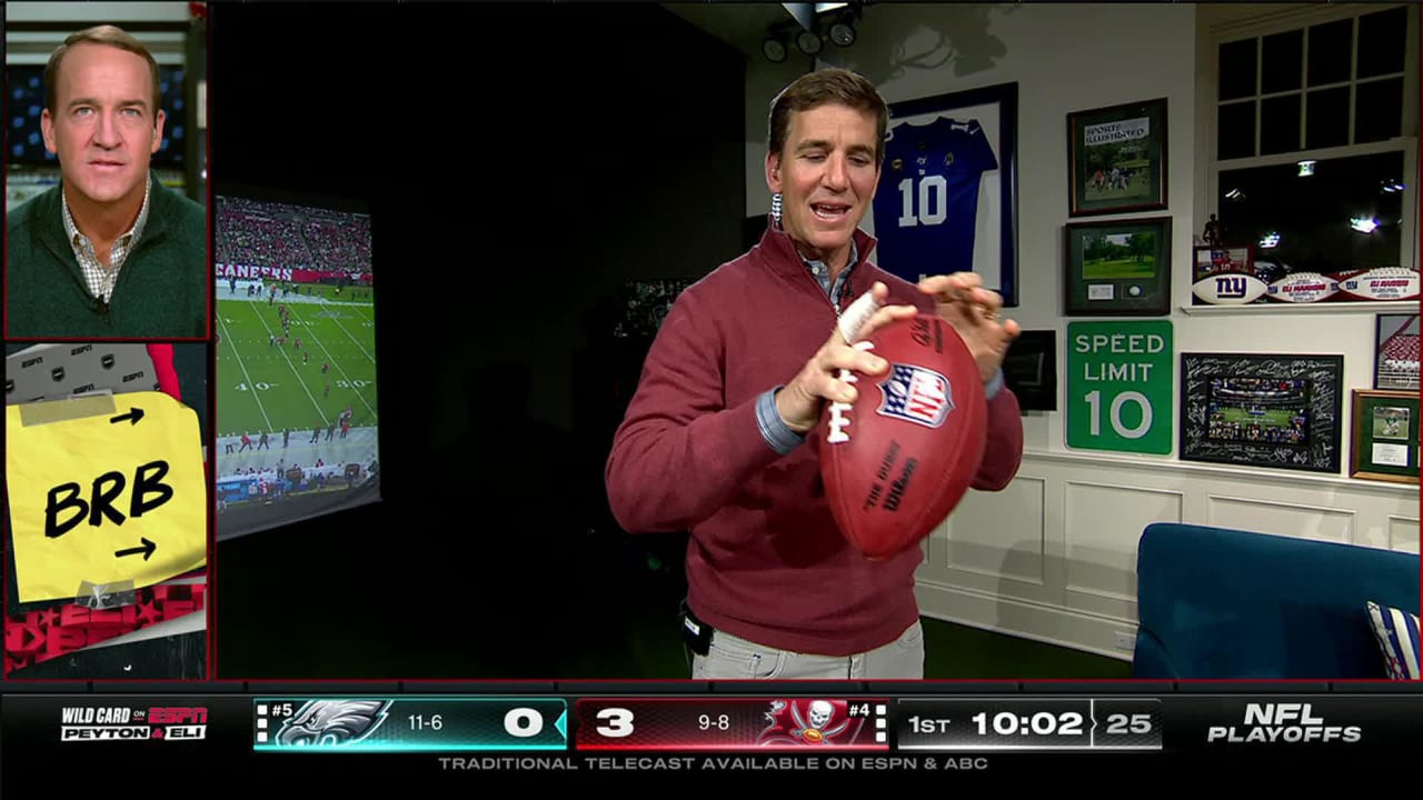 Eli Manning demonstrates how middle finger affects throwing the football