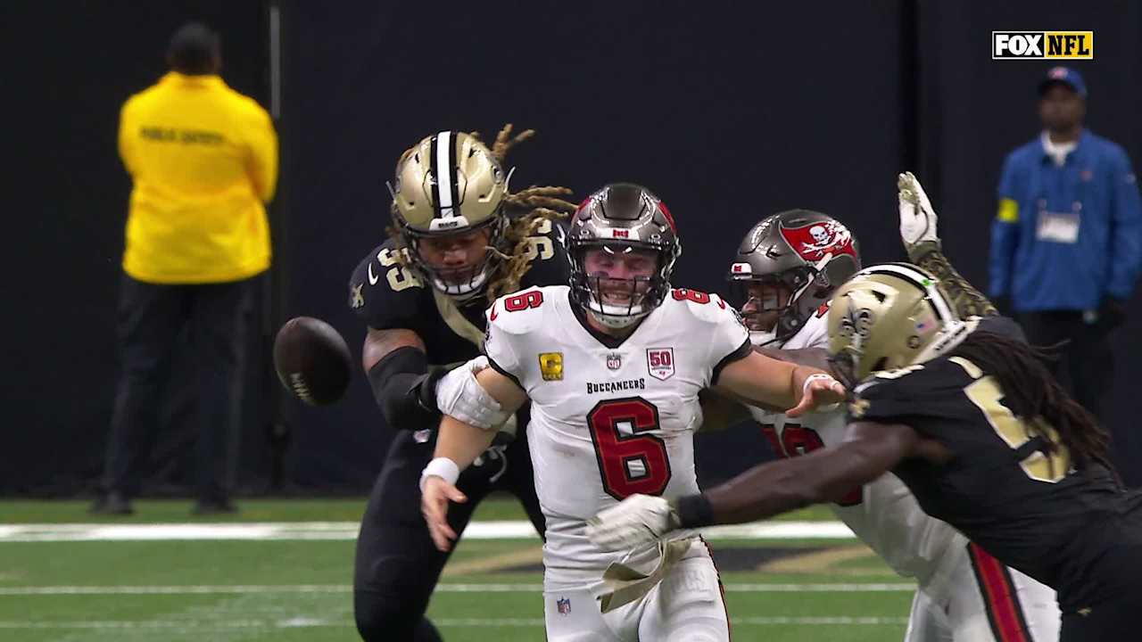New Orleans Saints defensive end Chase Young slaps the ball on Tampa ...