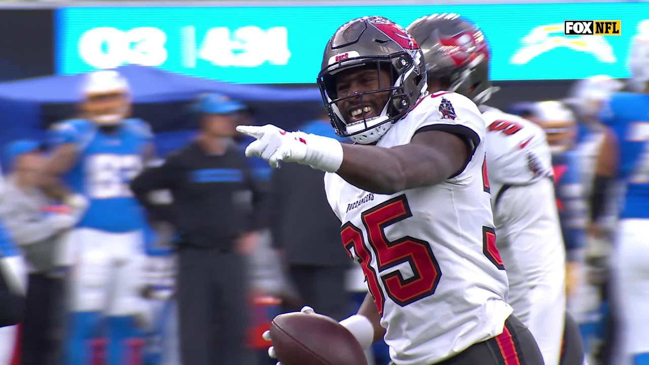 Tampa Bay Buccaneers quarterback Jamel Dean scoops Los Angeles Chargers ...