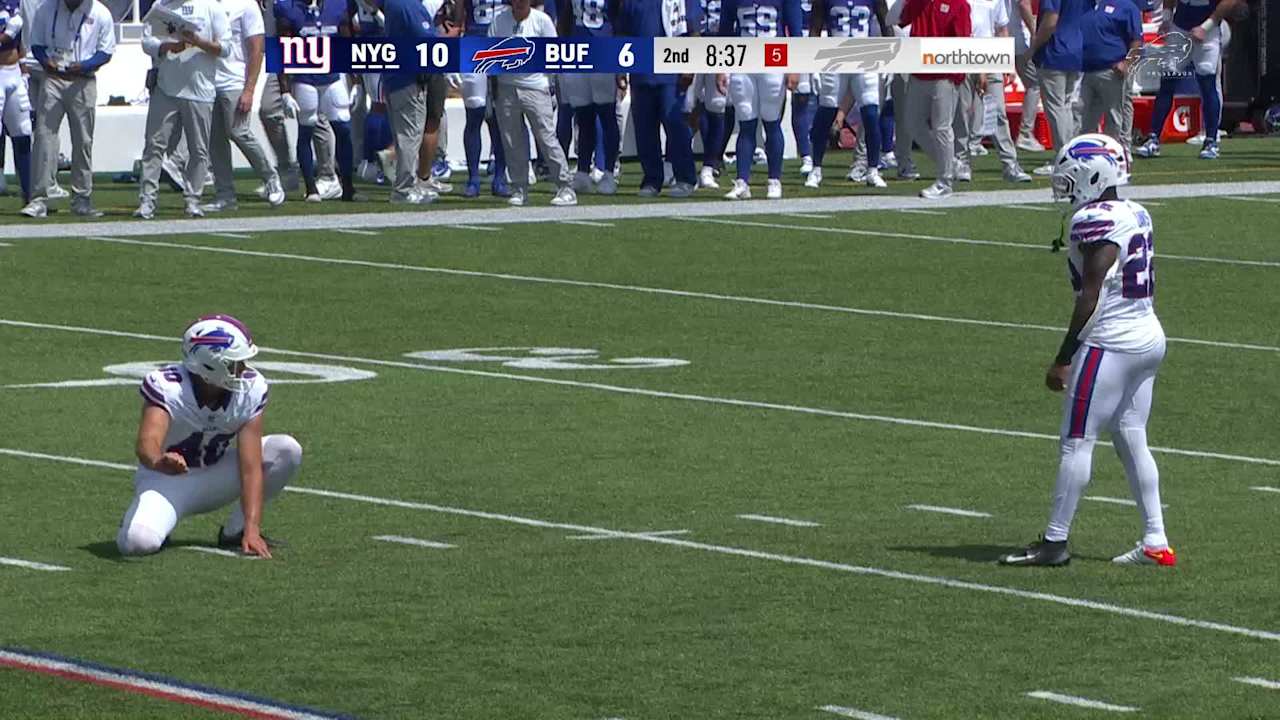 Running back Ray Davis shows off his kicking skills, drilling an extra ...