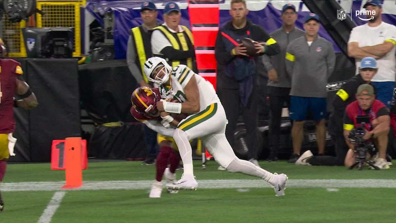 Green Bay Packers quarterback Jordan Love lowers his shoulder at the ...