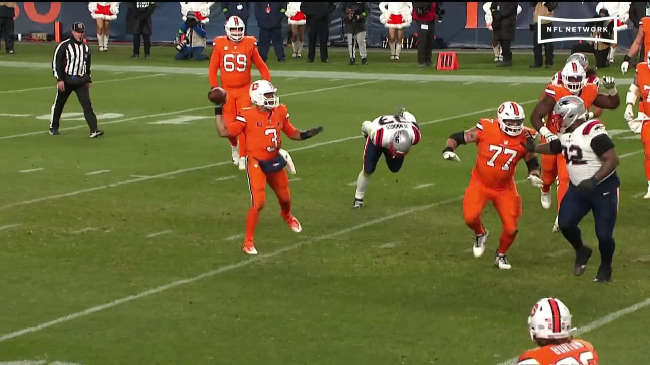 Denver Broncos quarterback Russell Wilson scrambles for a while before delivering a 13-yard dart ...