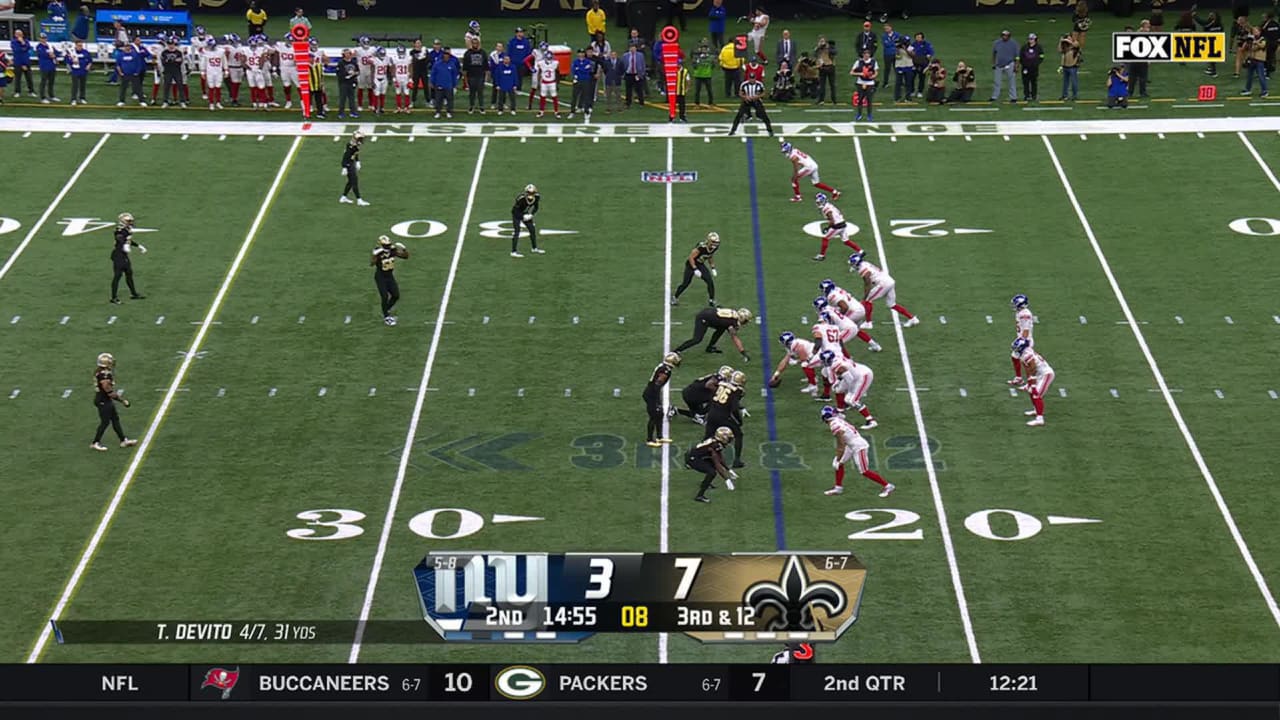 New Orleans Saints defensive end Tonah Kpassagnon breaks out New York Giants quarterback Tommy ...