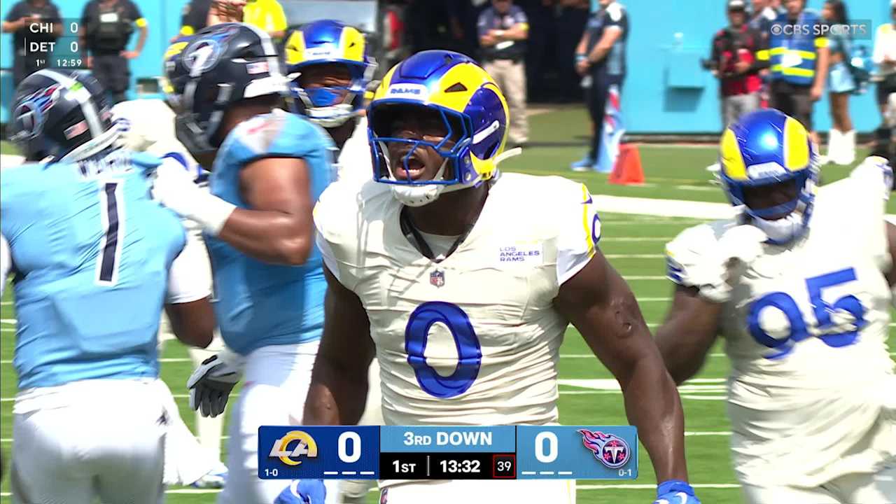 Los Angeles Rams outside linebacker Byron Young sacks Tennessee Titans quarterback Cam Ward to ...