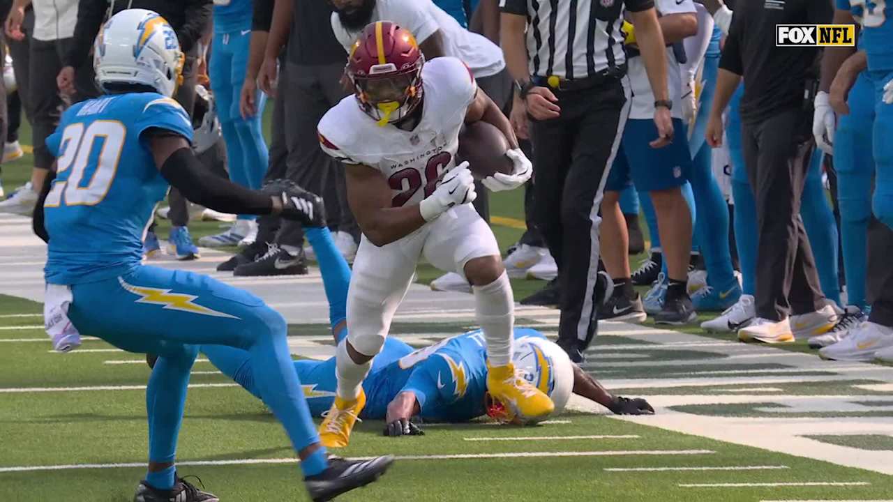 Washington Commanders running back Jeremy McNichols lowers shoulder to ...