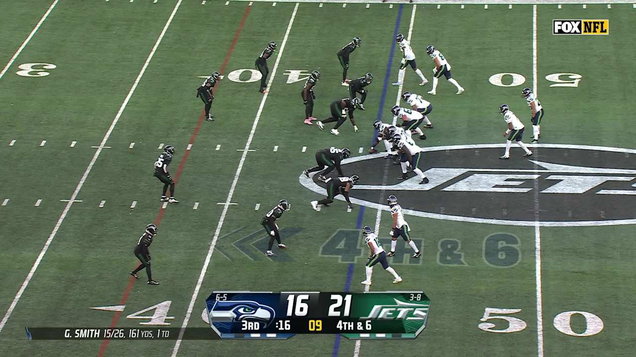 Quarterback Geno Smith's back foot 24-yard throw to wide receiver Jaxon ...