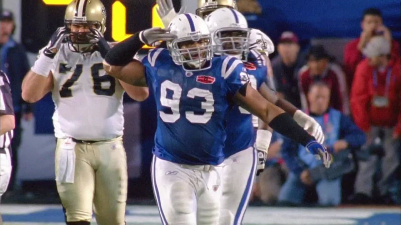 Indianapolis Colts owner Jim Irsay presents former defensive end Dwight ...