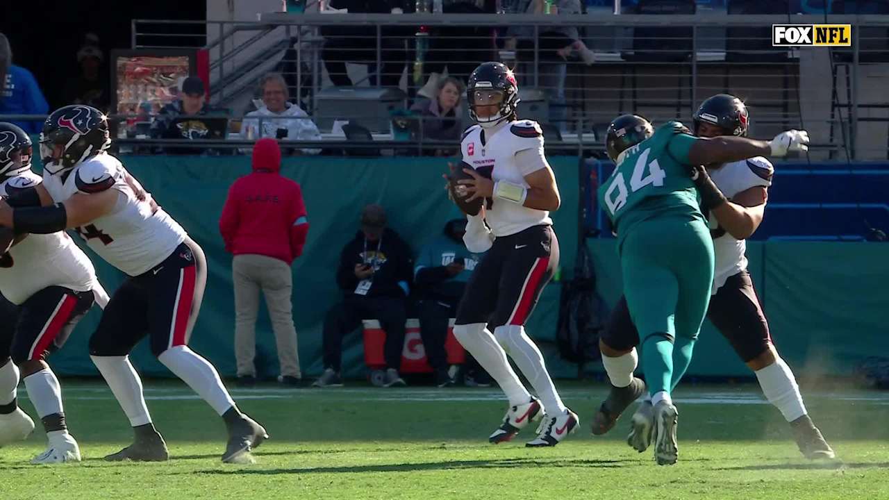 Houston Texans quarterback C.J. Stroud fits ball into tight window to wide receiver Nico Collins ...