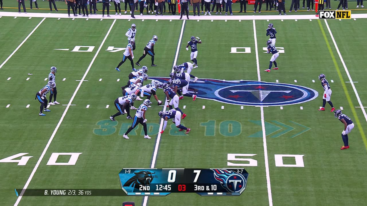 Carolina Panthers quarterback Bryce Young steps through pressure on a chain-moving third-down ...