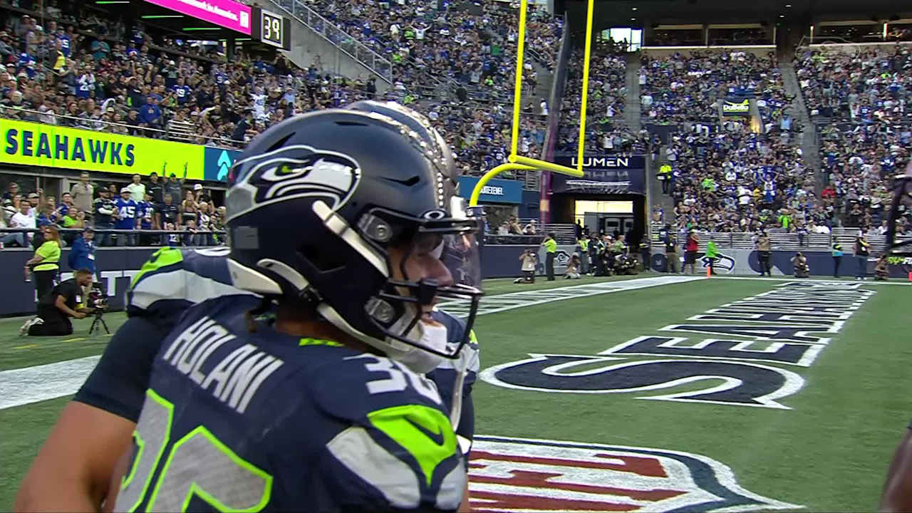 Seattle Seahawks running back George Holani caps his 23-yard rumble ...