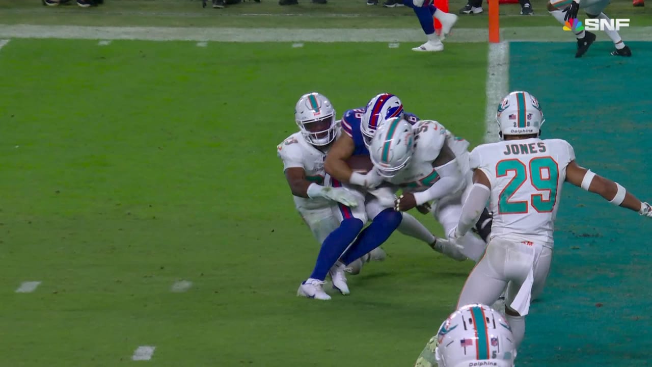 Miami Dolphins linebacker Jerome Baker stonewalls Buffalo Bills running back Ty Johnson at 1 ...