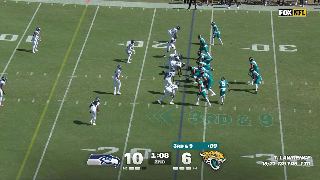 Seattle Seahawks linebacker DeMarcus Lawrence drops Jacksonville Jaguars quarterback Trevor ...