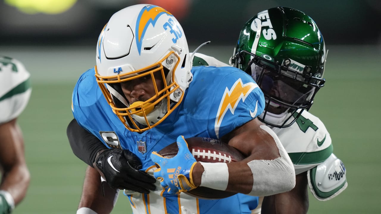 Los Angeles Chargers running back Austin Ekeler fights through facemask ...