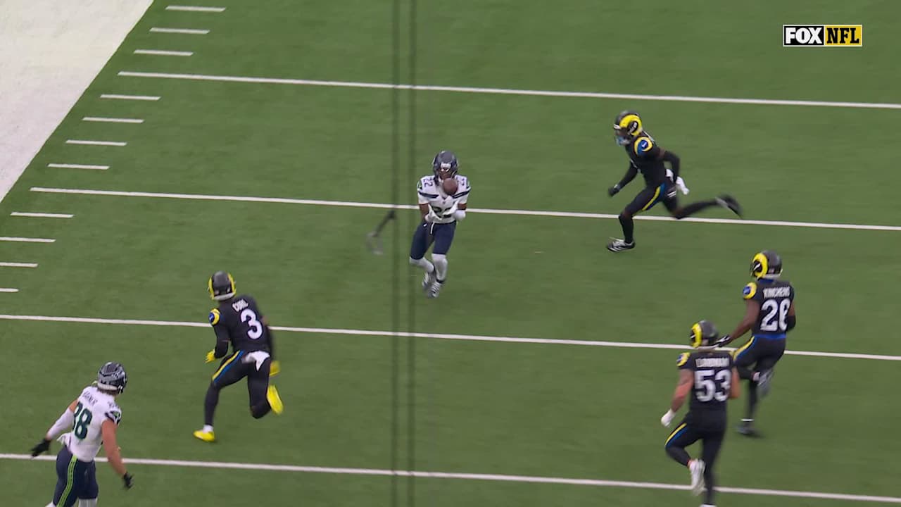 Seattle Seahawks quarterback Sam Darnold rips a 21-yard pass to wide ...